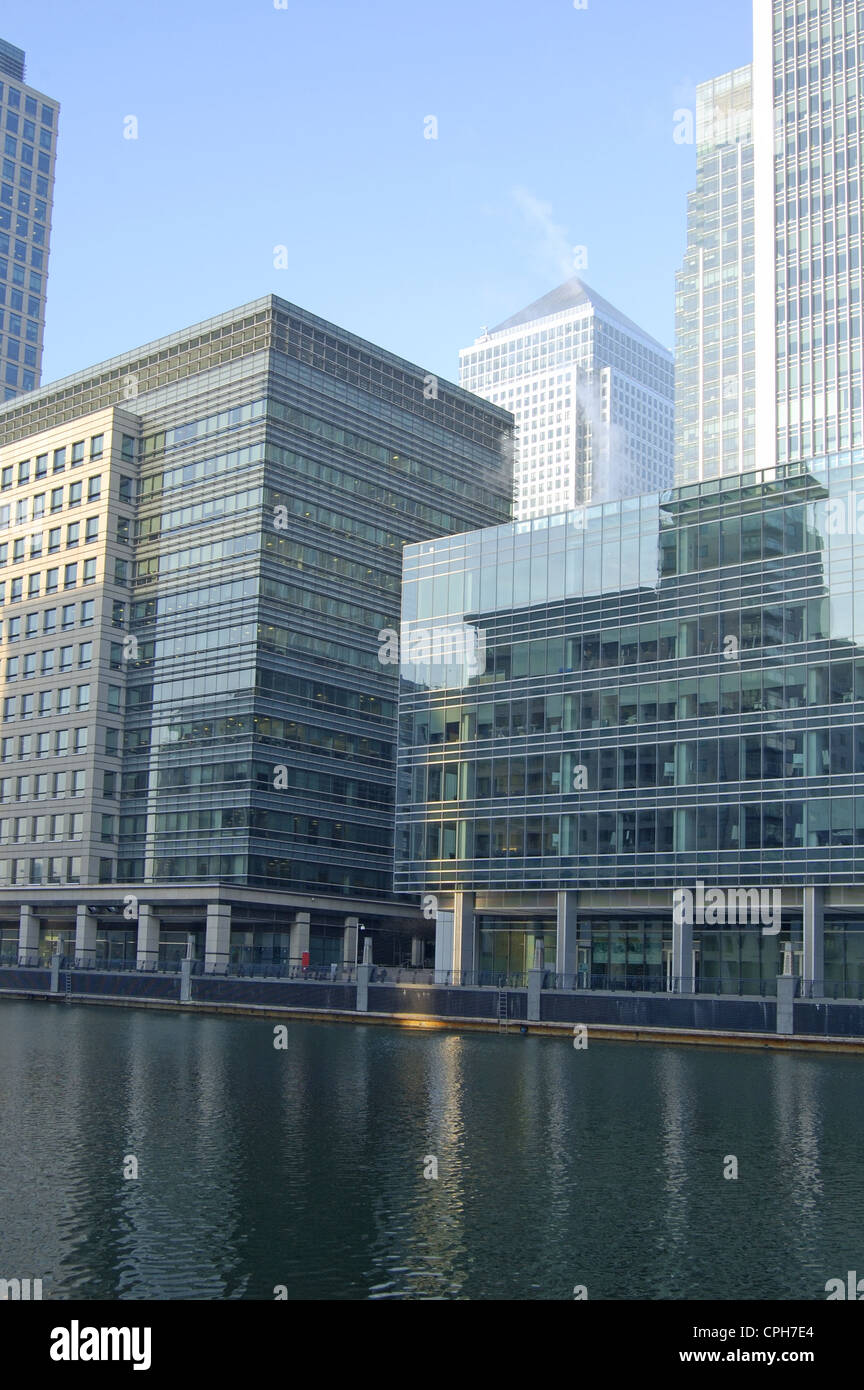 Waterfront office buildings and quayside at Canary Wharf in London ...