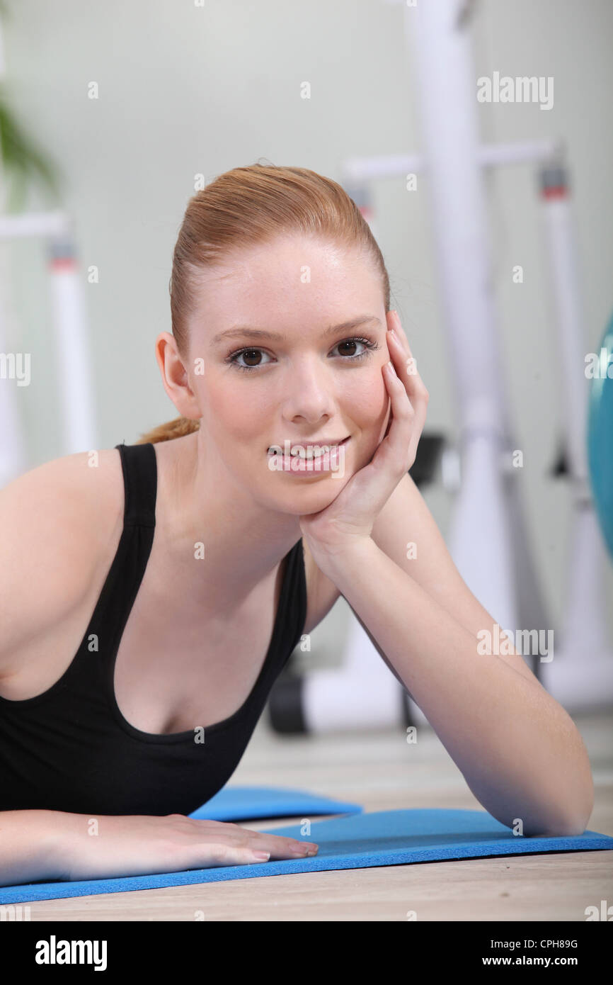 Red-haired girl in the gym Stock Photo - Alamy