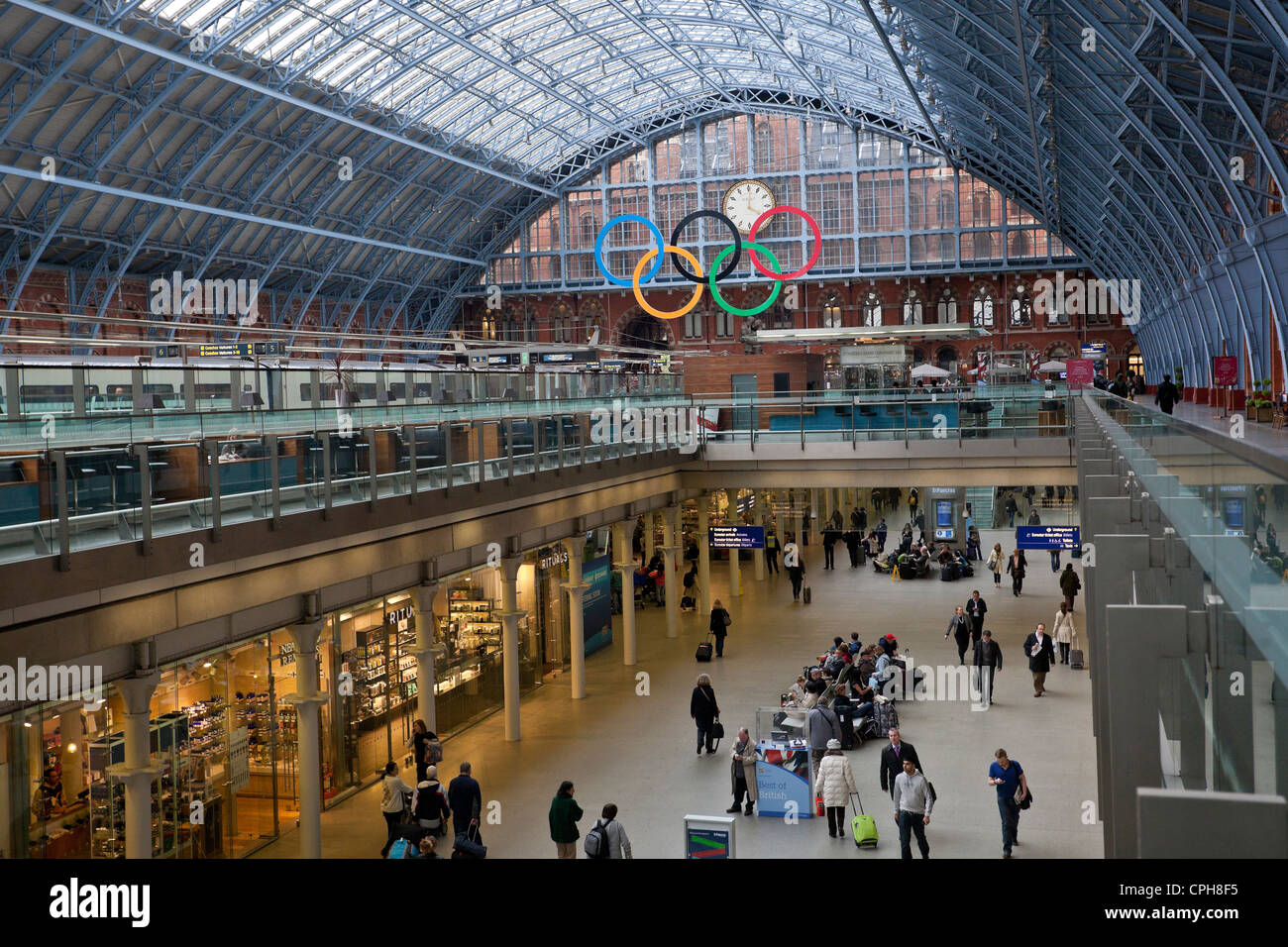 A view inside St Pancras Station with the Olympic Rings at the back ...
