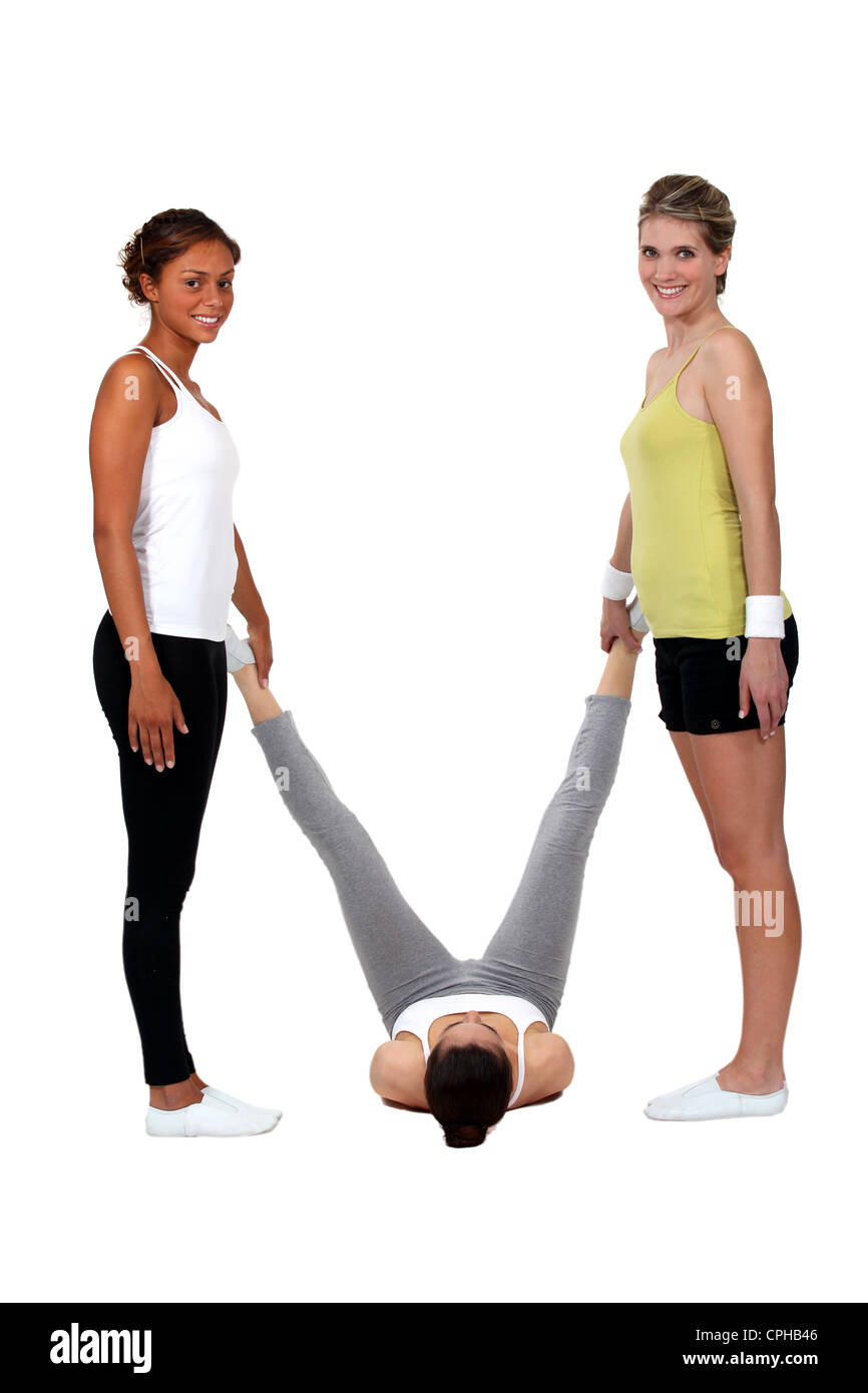 Three girls doing gymnastics hi-res stock photography and images - Alamy