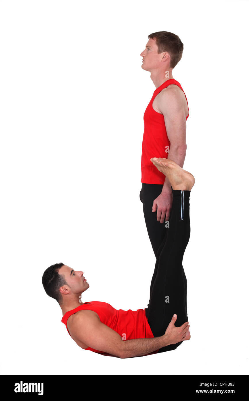 Men in gymwear making the letter J Stock Photo - Alamy