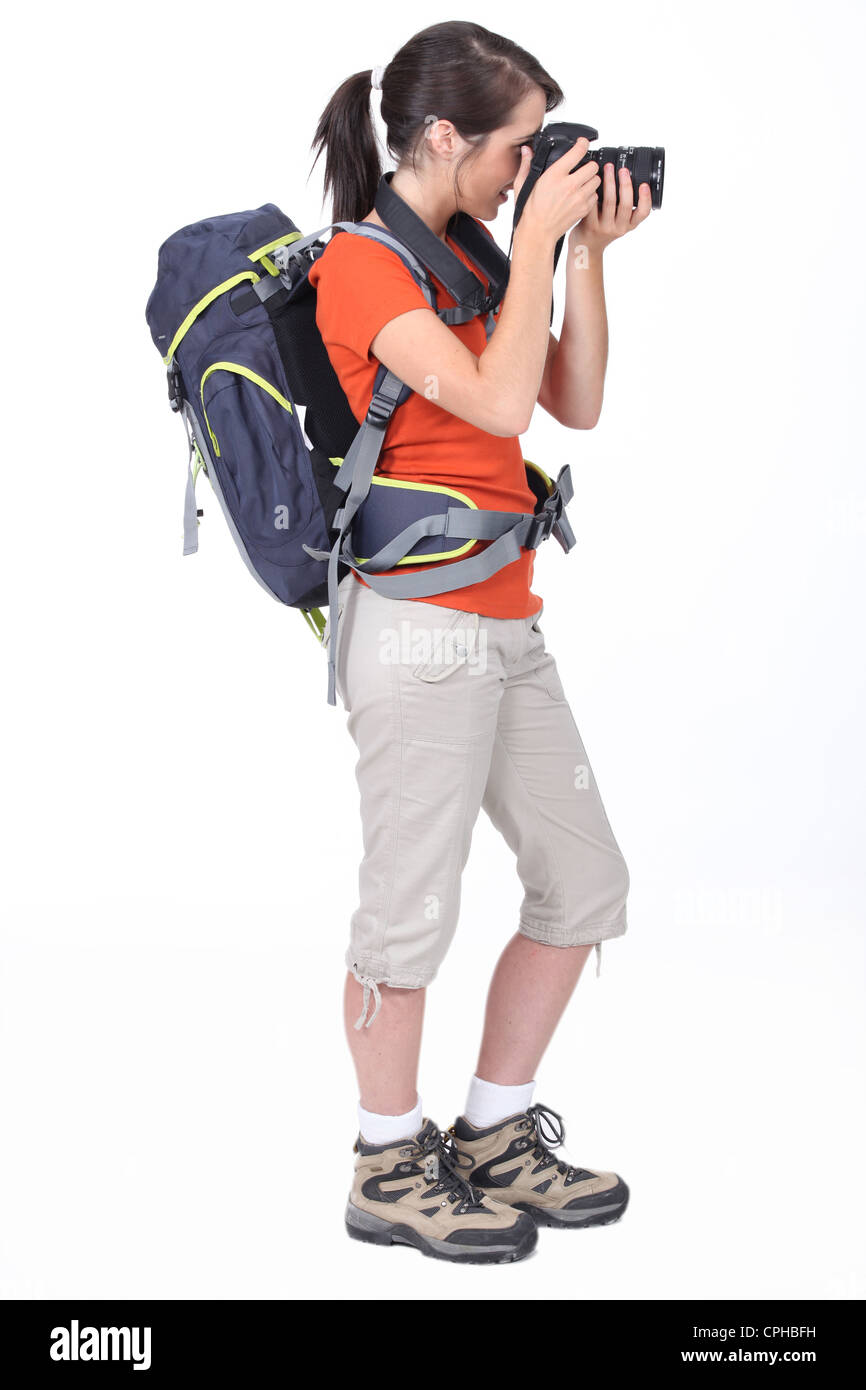 Backpacker with a camera Stock Photo - Alamy