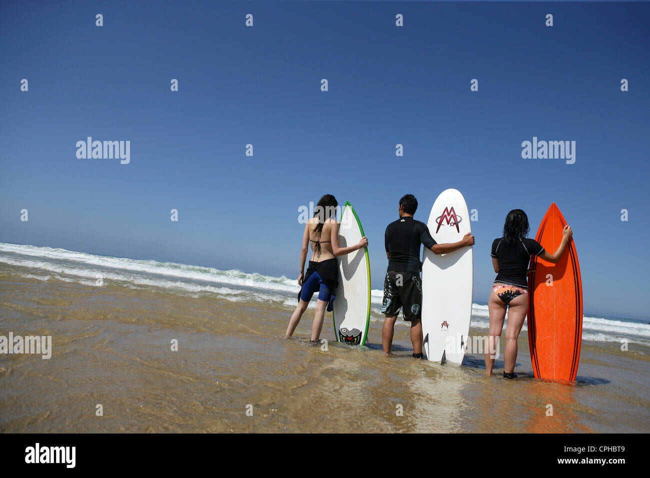 Friends with surf boards Stock Photo - Alamy