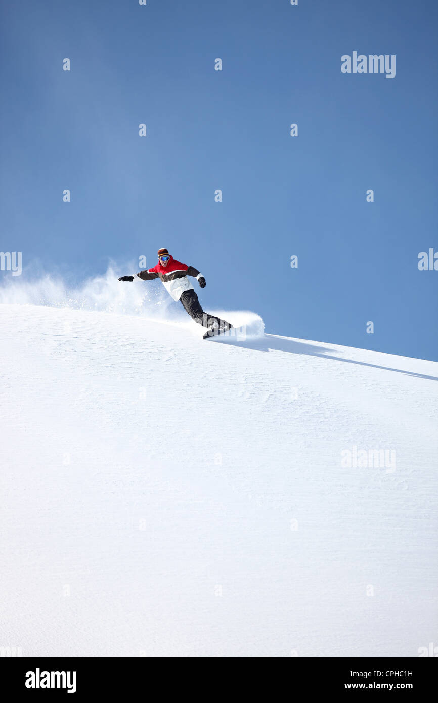 Snowboarder showing-off his skills Stock Photo - Alamy