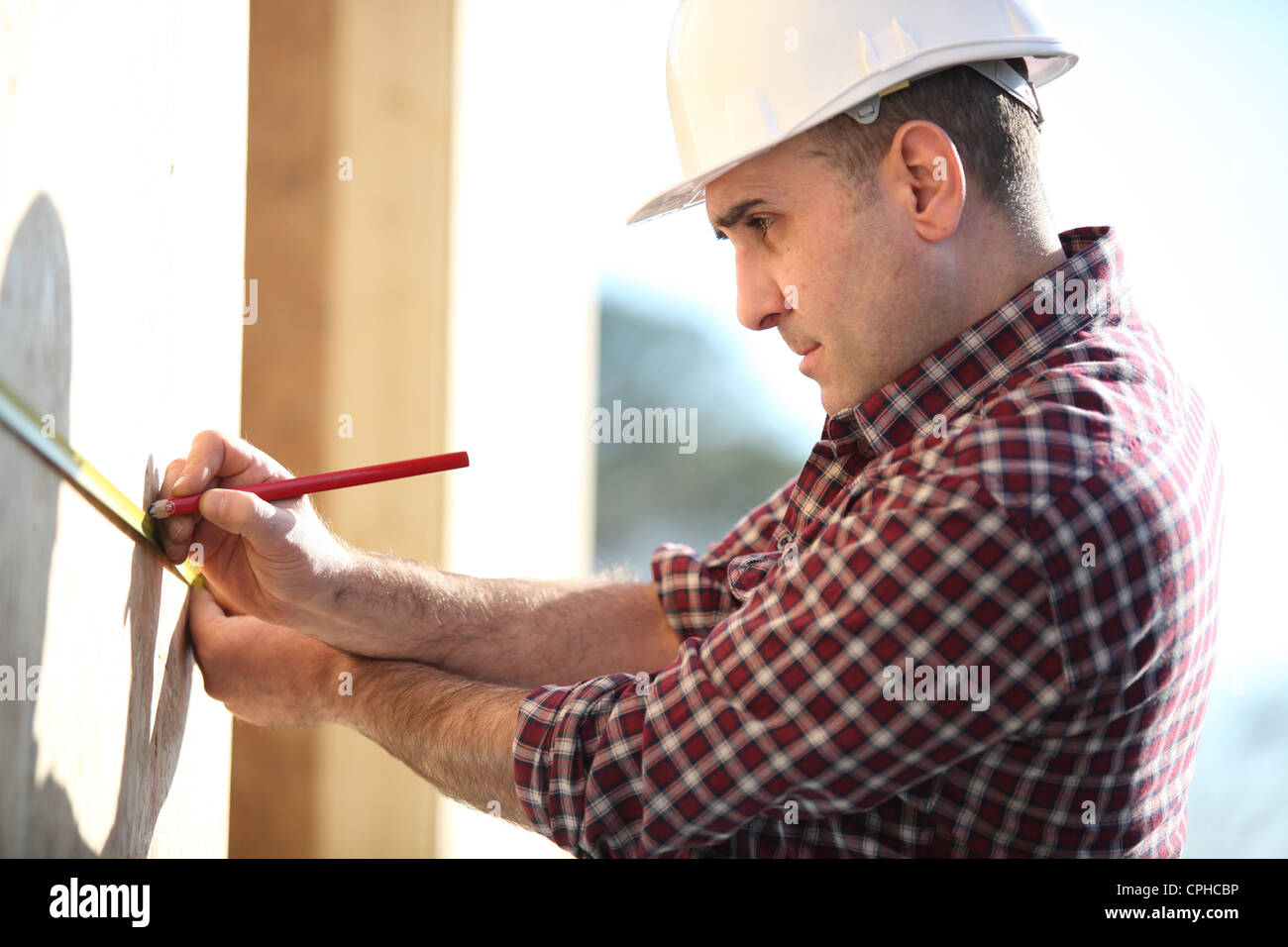 Carpenter marking wooden panel Stock Photo - Alamy