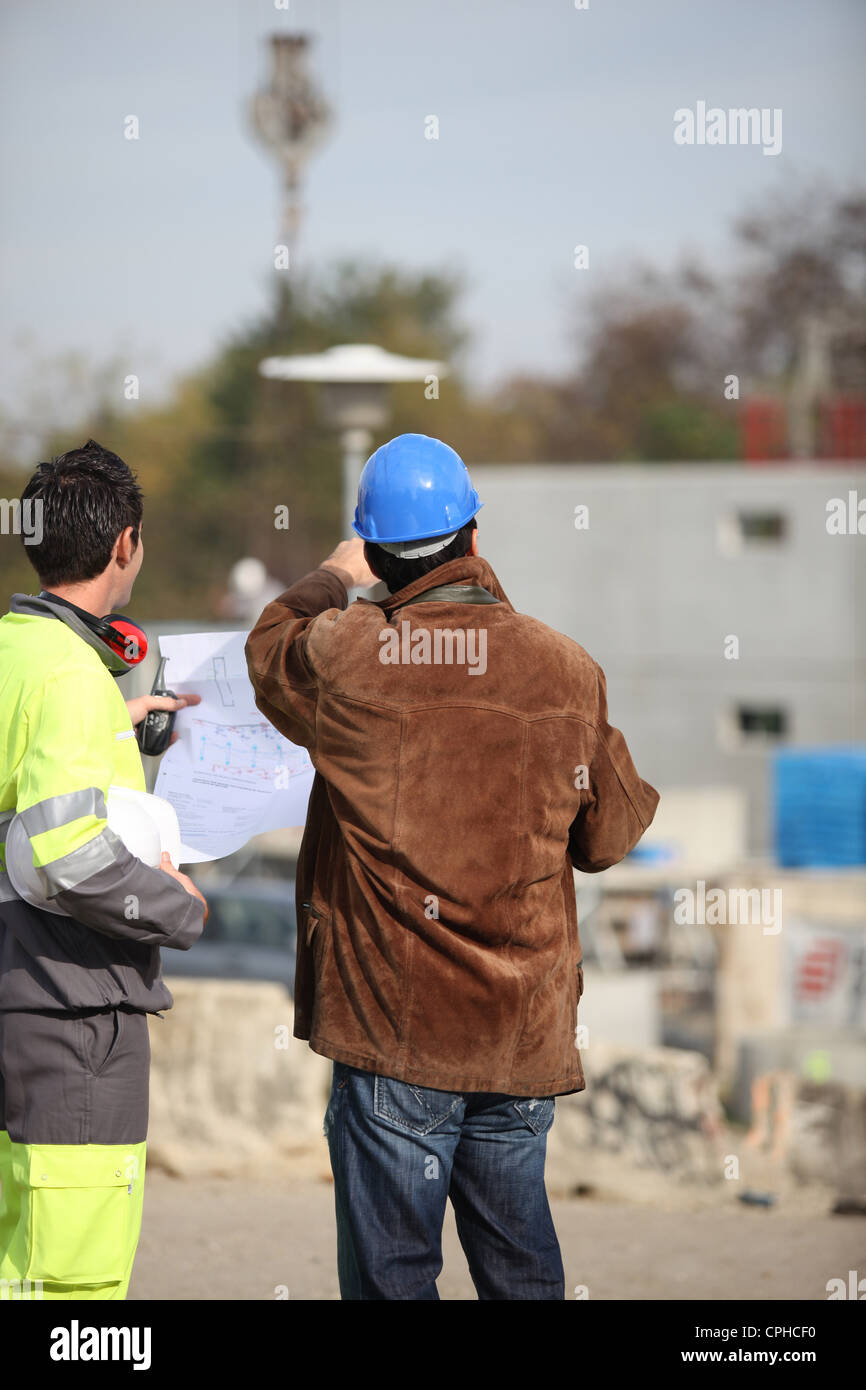 Men on a construction site Stock Photo - Alamy