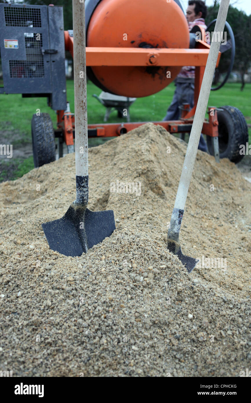 Cement mixer and shovels Stock Photo - Alamy