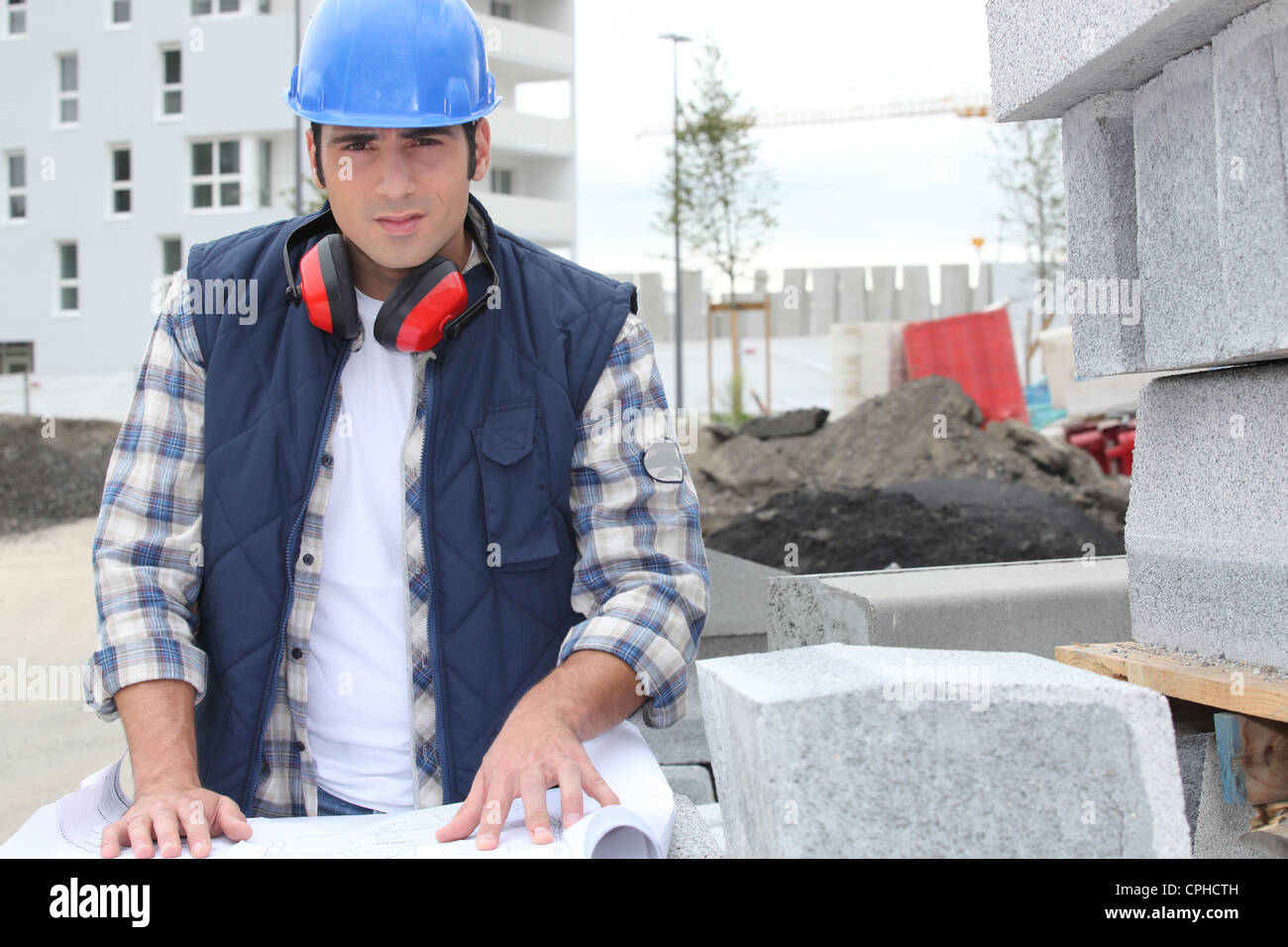 construction worker looking at his plans Stock Photo - Alamy