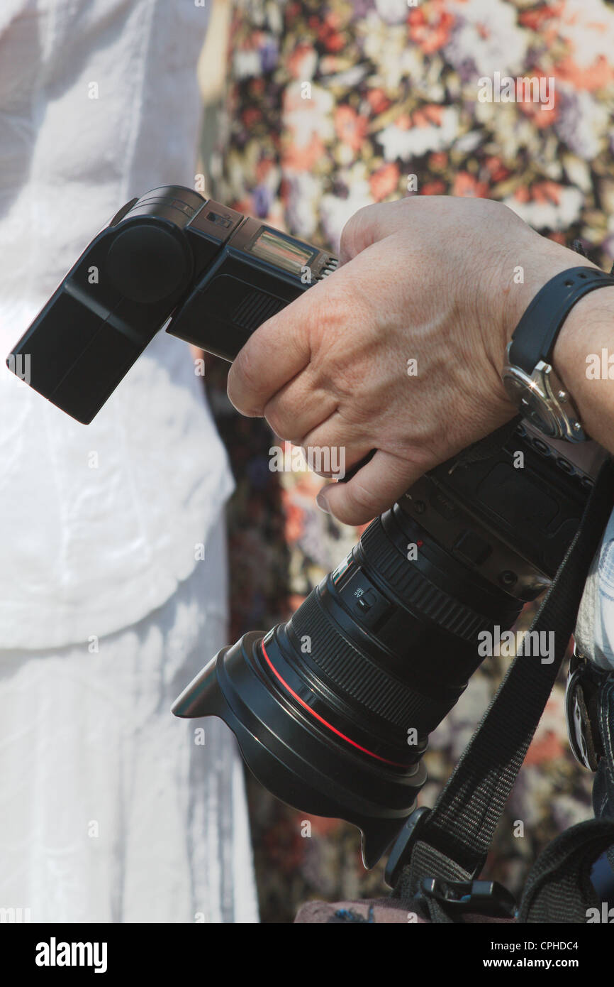 Photographer holding a the camera Stock Photo - Alamy