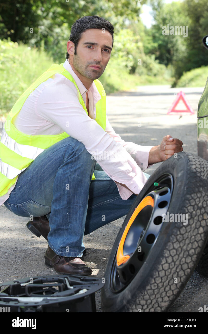 Man with a puncture Stock Photo - Alamy