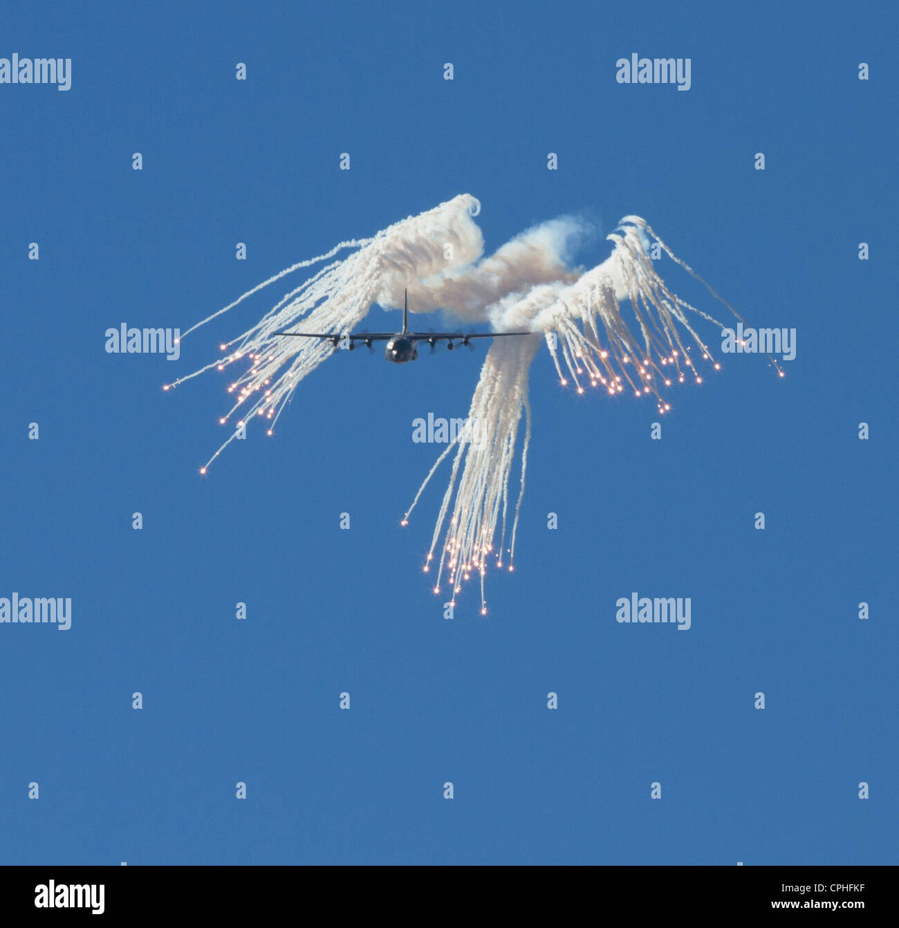 A Royal New Zealand Air Force C130 Hercules releasing defensive flares ...
