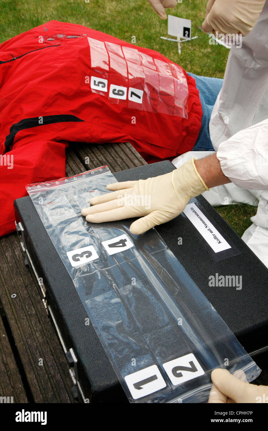 Police, crime scene investigation. Murder case. Police saves fiber ...