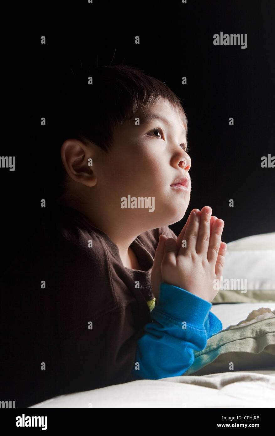 Child praying bedtime hi-res stock photography and images - Alamy