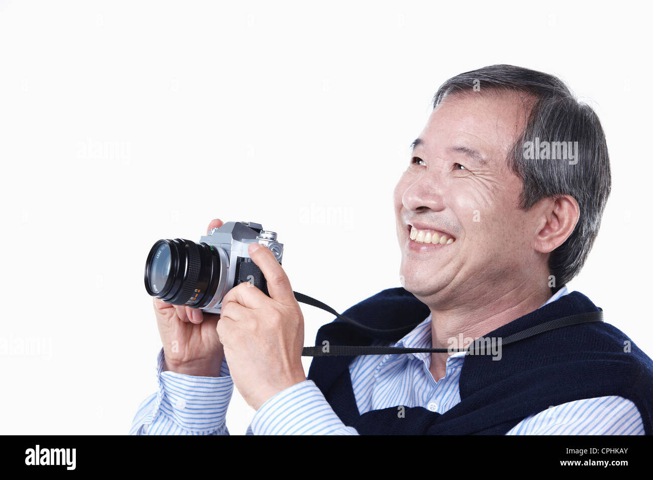 An old man photographing with camera Stock Photo - Alamy