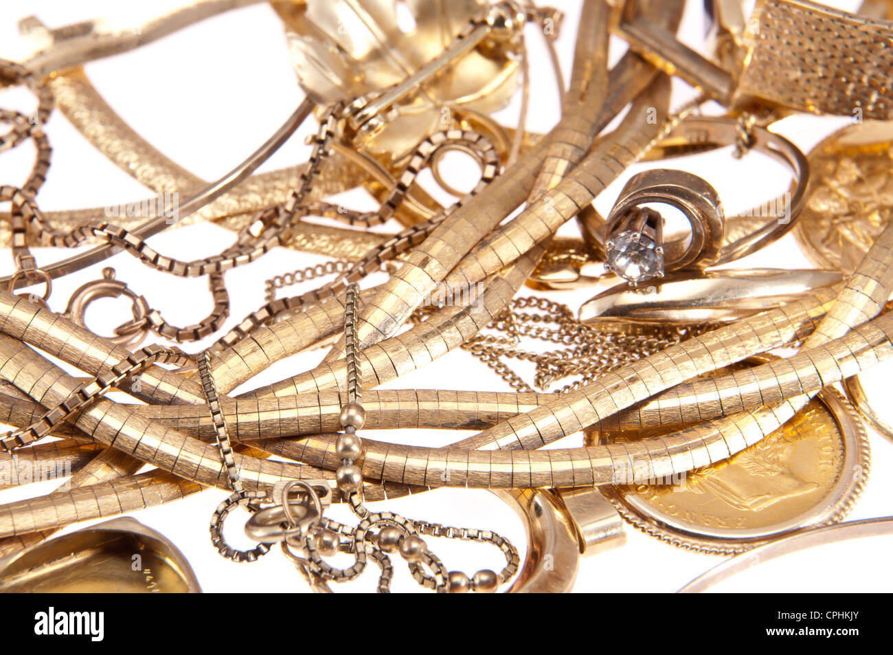 A heap consisting of old/antique jewellery ready for recycling isolated ...