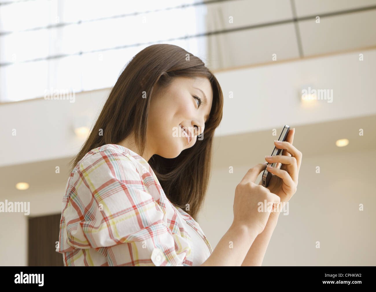 Middle-aged woman using a smartphone Stock Photo - Alamy