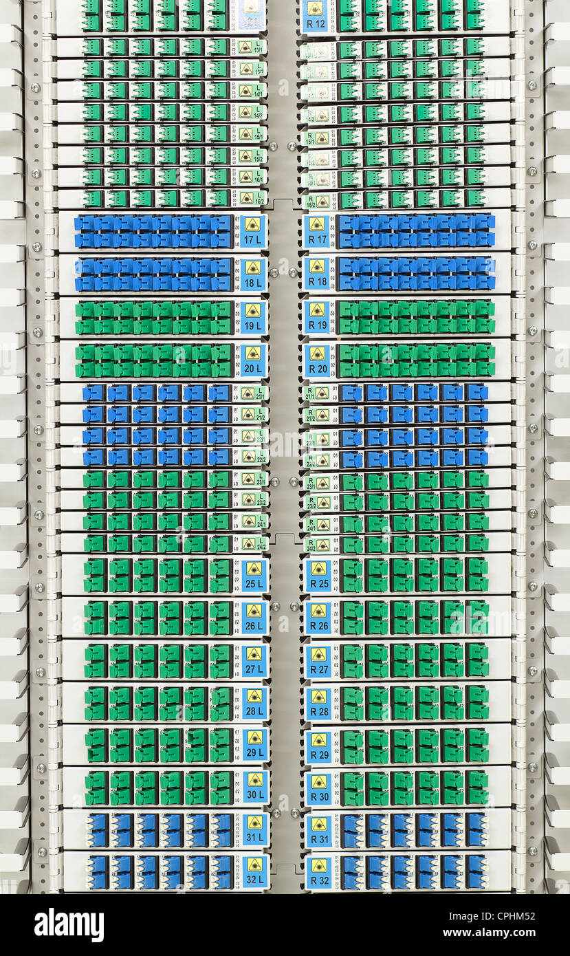 fiber optic cable management system with green and blue SC connectors ...