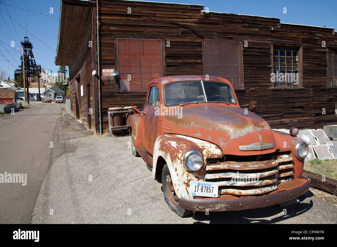 Old Chevy truck, mine headframe, Butte, Montana, USA Stock Photo - Alamy