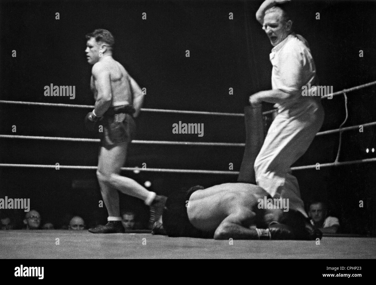 Merlo Preciso goes to the floor in a fight with Alfred Heuser, 1939 ...