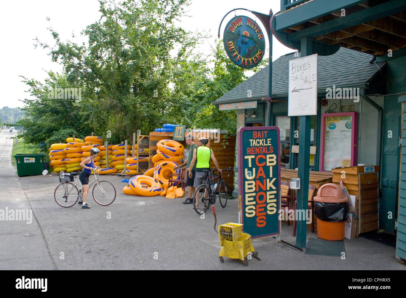 Bicyclists considering large tubes for floating down the Root River ...
