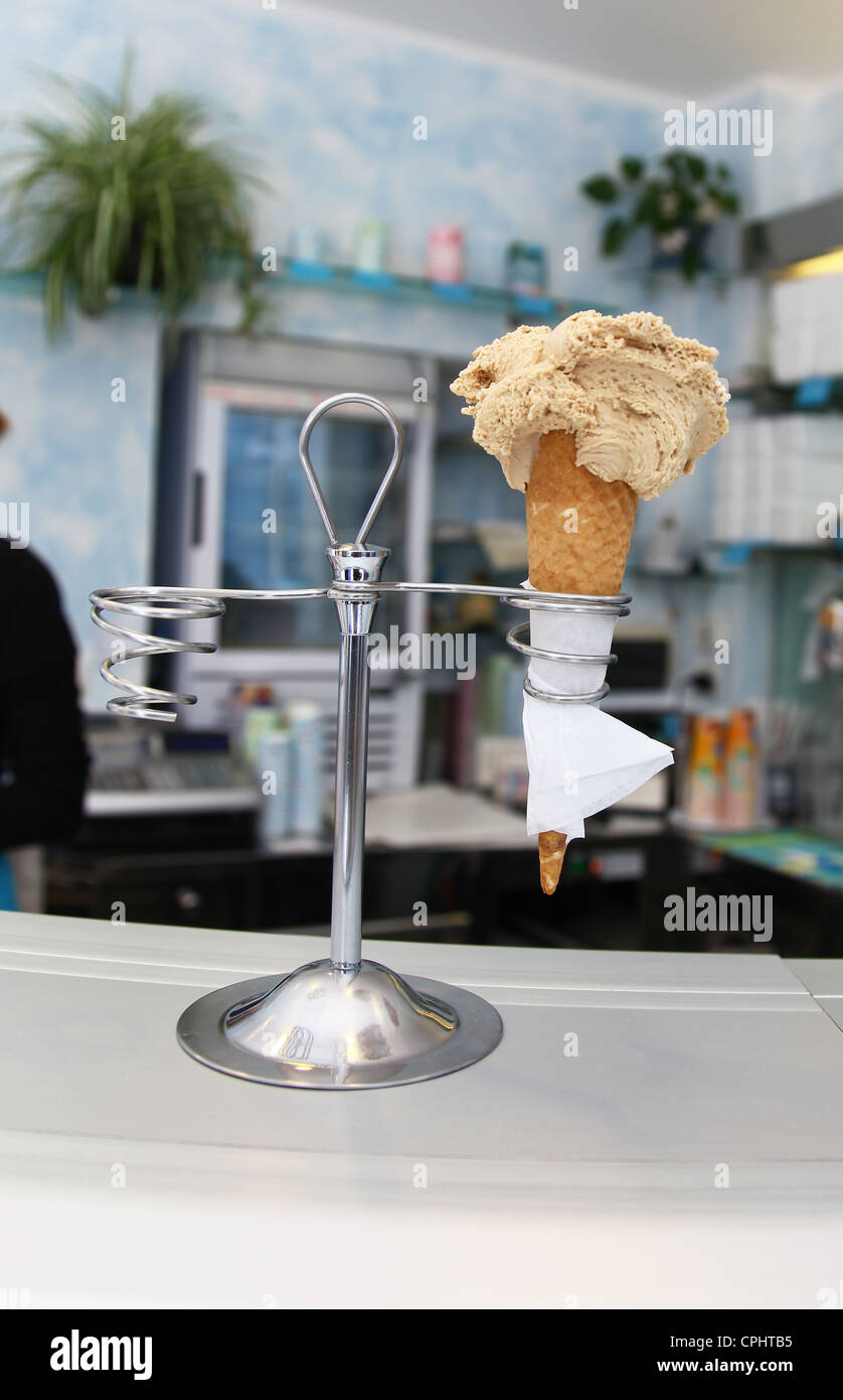 An Italian ice cream parlour or Gelateria serving an ice cream cone or ...