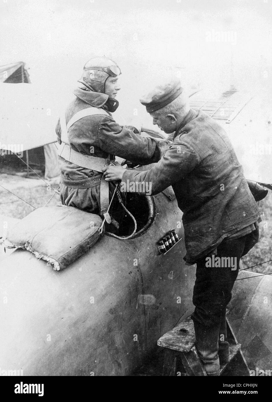 German pilot climbs into his machine, 1918 Stock Photo - Alamy