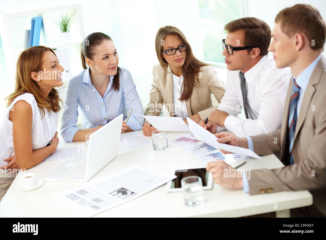 Image of confident partners sharing new ideas at meeting Stock Photo ...