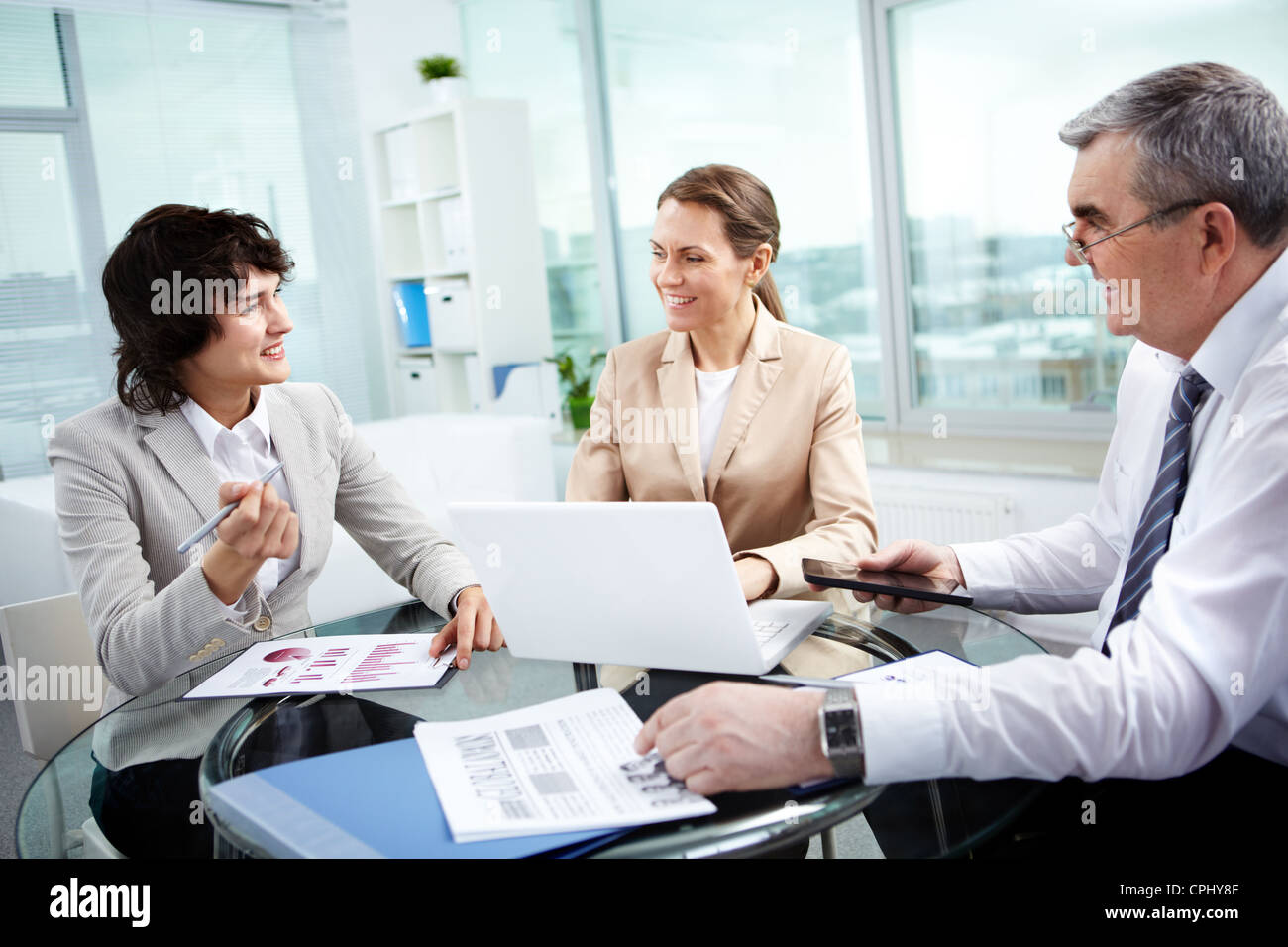 Business group working together in office Stock Photo - Alamy