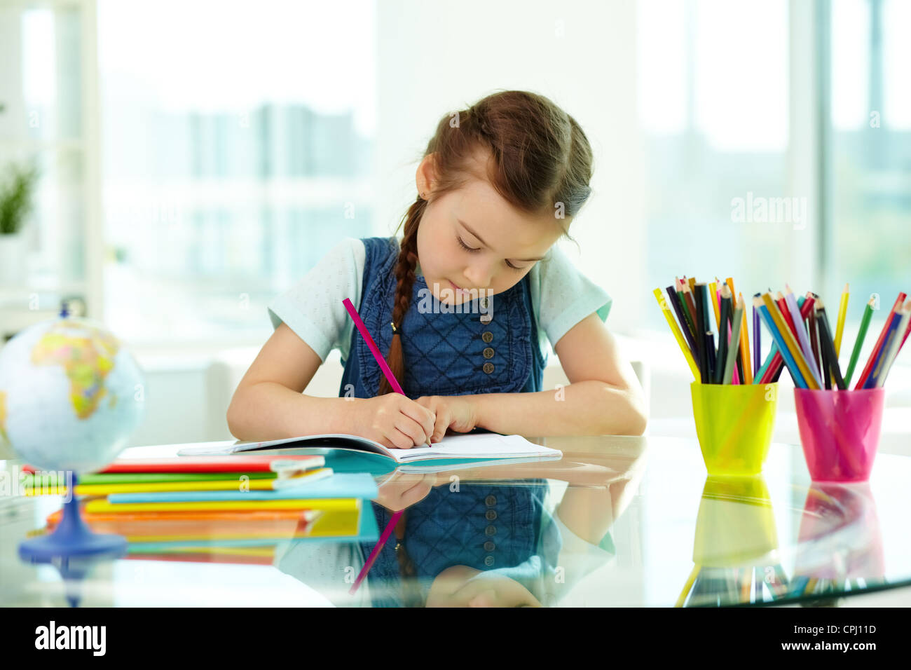 Portrait of lovely girl drawing with colorful pencils Stock Photo - Alamy
