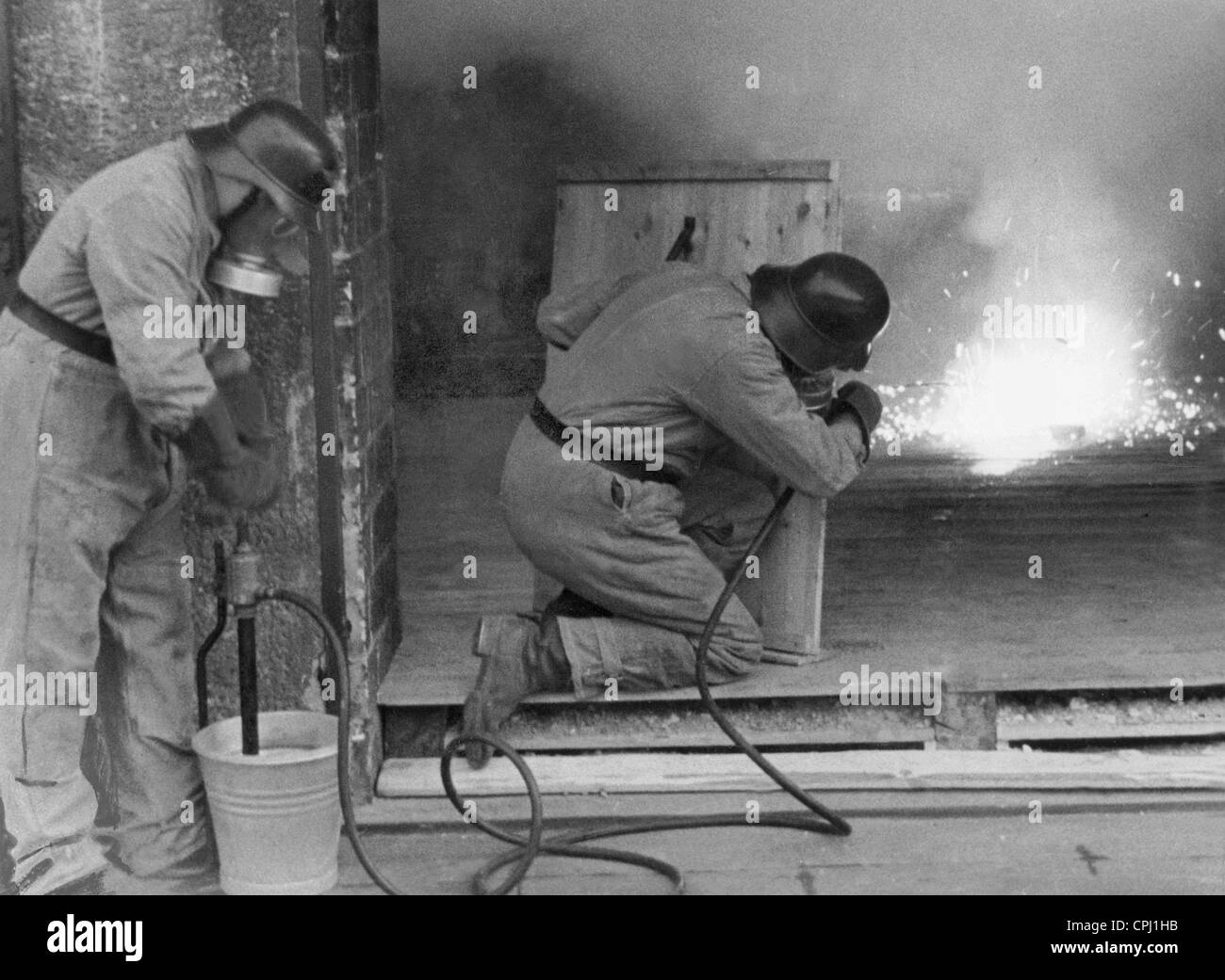 Training for extinguishing a fire bomb, 1941 Stock Photo - Alamy