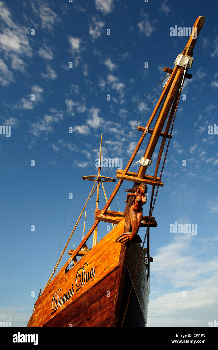 A traditional cruise Phinisi or Pinisi vessel in Indonesia nearby the ...