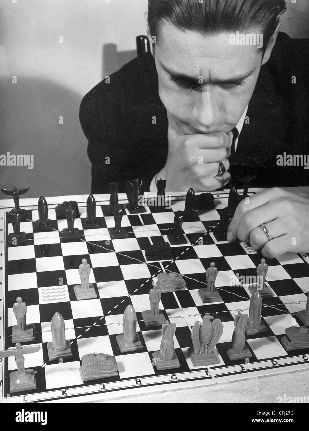 A man playing a Wehrmacht board game, 1937 Stock Photo - Alamy