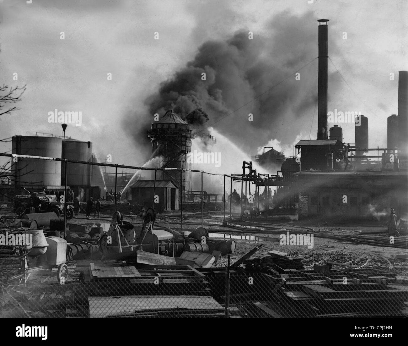 Burning oil tanks in an oil refinery, 1926 Stock Photo - Alamy