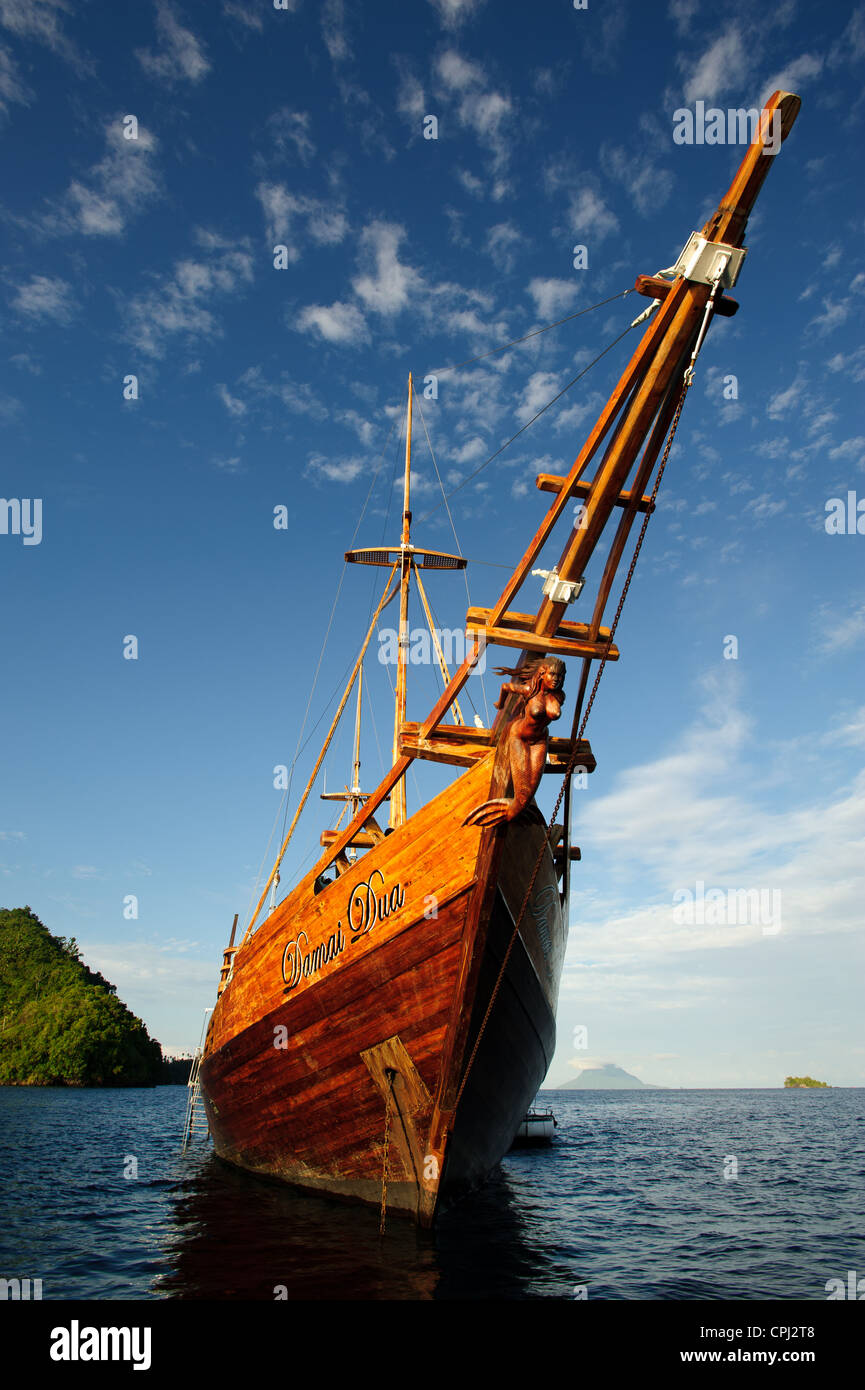 A traditional cruise Phinisi or Pinisi vessel in Indonesia nearby the ...