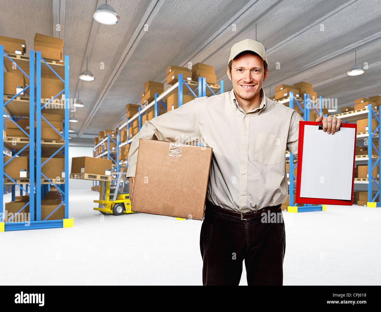 caucasian delivery man in warehouse Stock Photo - Alamy