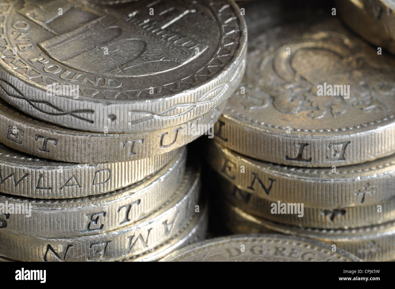 UK one pound coins, pile of one pound coins. pile of money. stack of ...