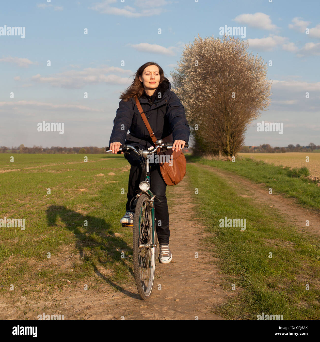 Woman rides a bike Stock Photo - Alamy