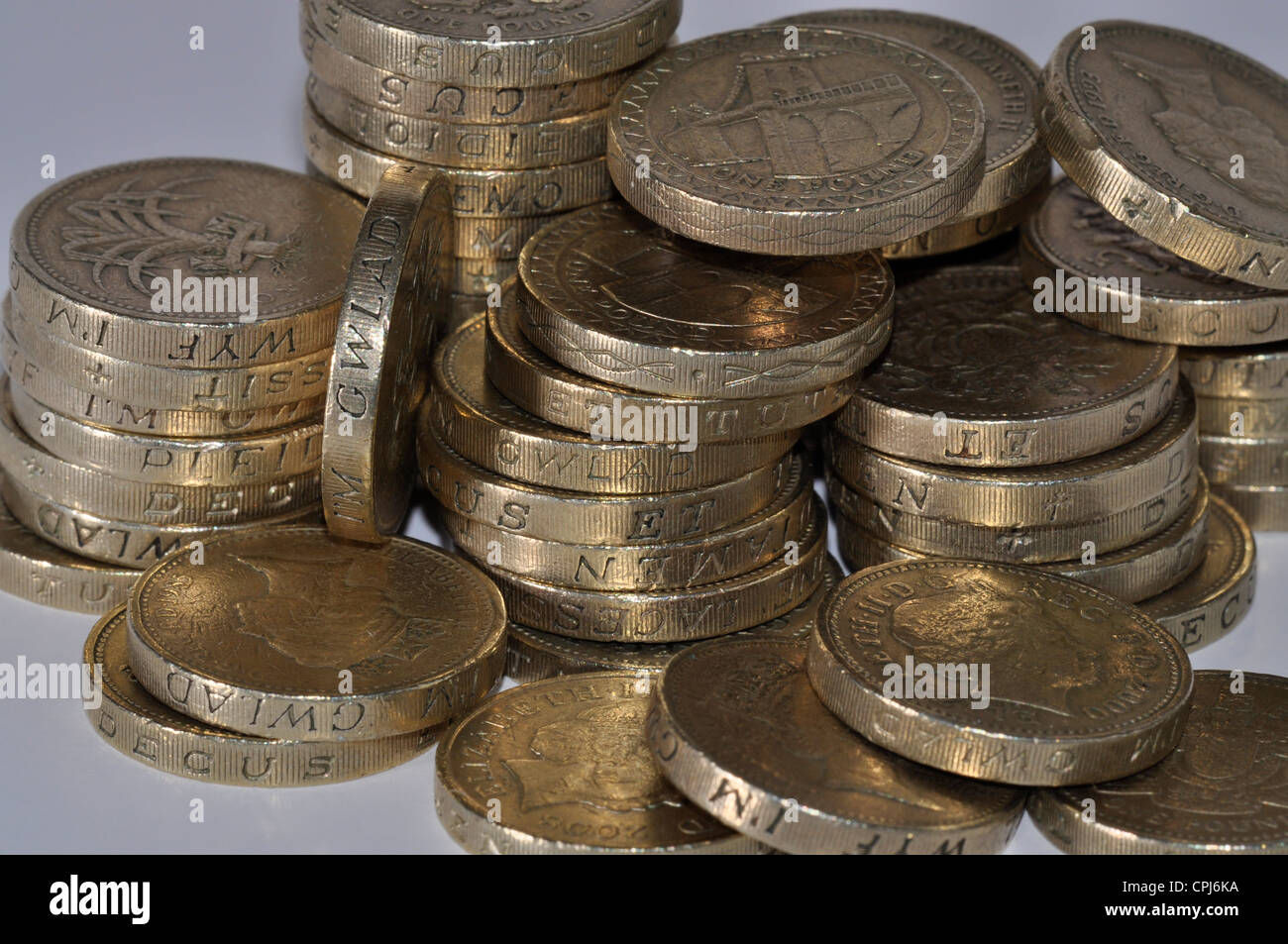 UK one pound coins, pile of one pound coins. pile of money. stack of ...
