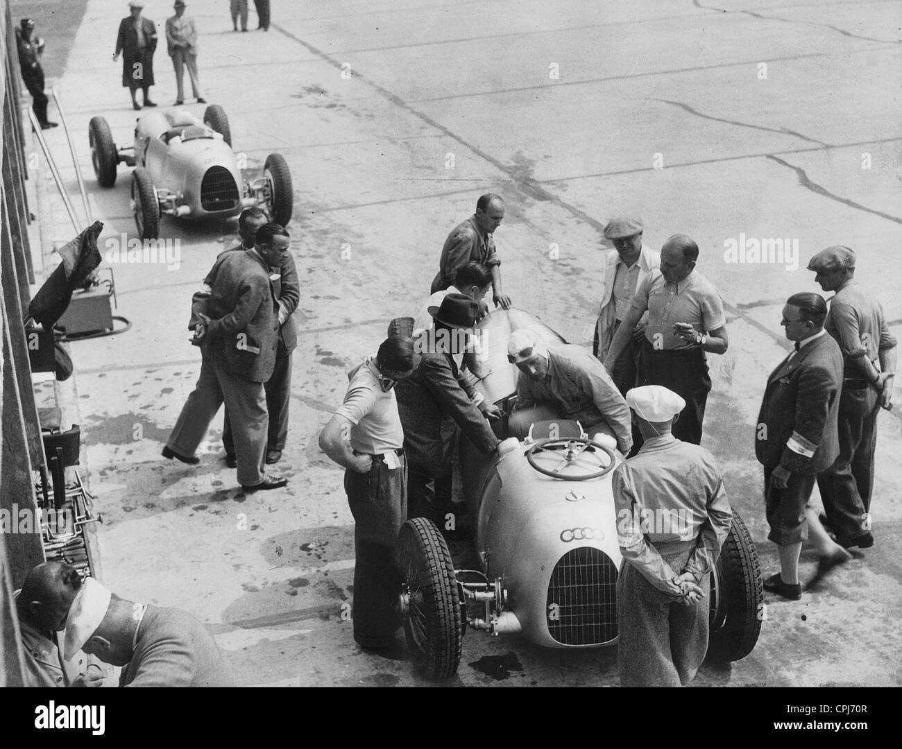 Training at the Nuerburgring: Hans Stuck gets out of his racing car ...
