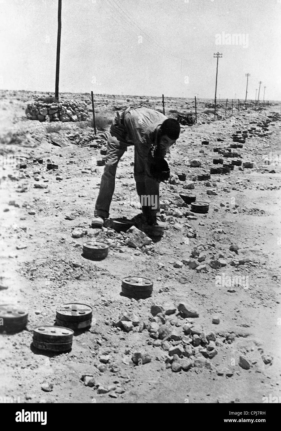 Italian sapper clearing British mines, Mersa Matruh, 1942 (b/w photo ...