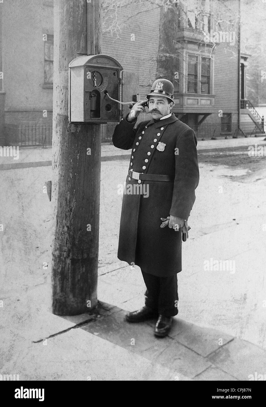 Police officer at a telephone pillar, 1903 Stock Photo - Alamy