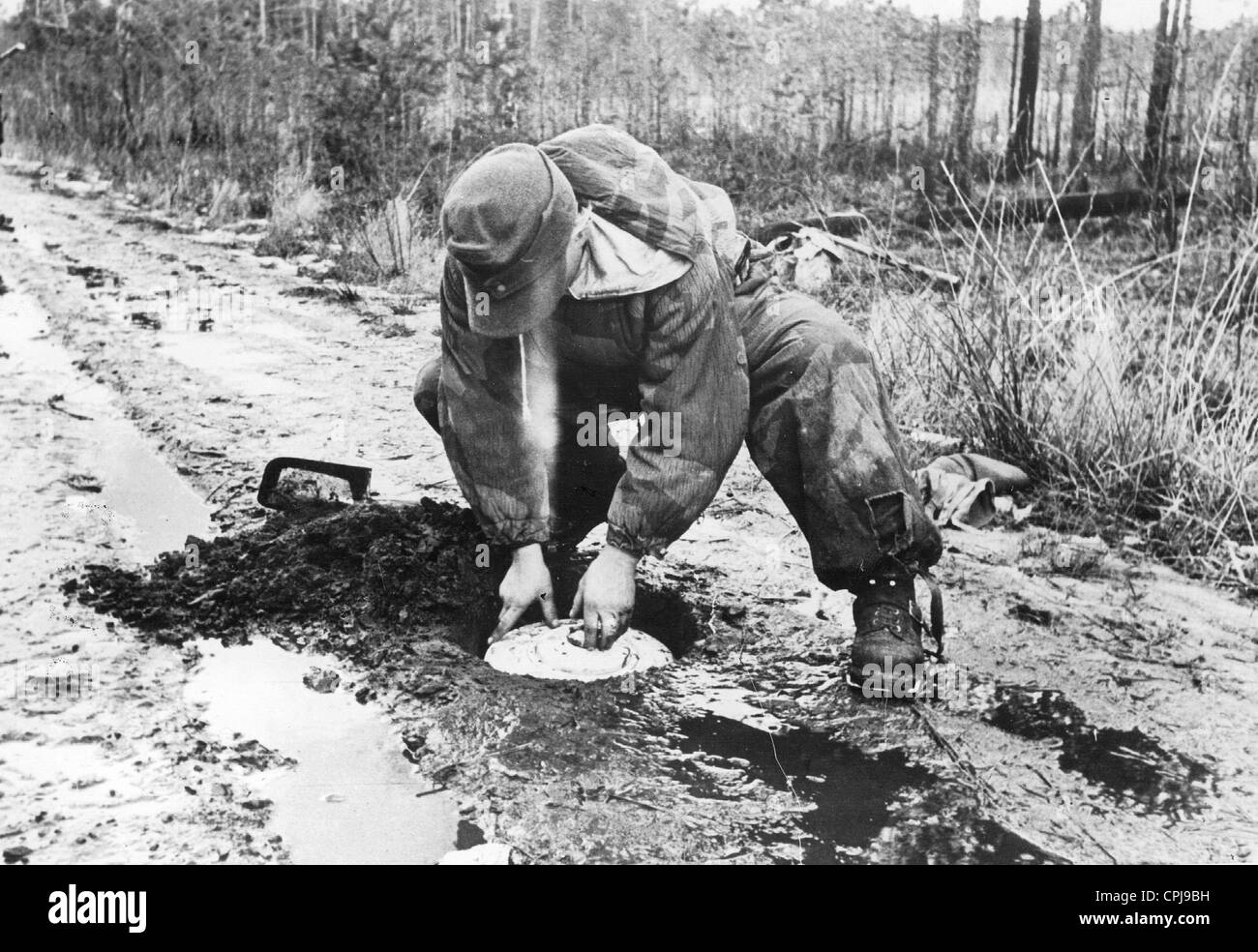 German soldier lays a tank mine on the Eastern front, 1944 Stock Photo ...