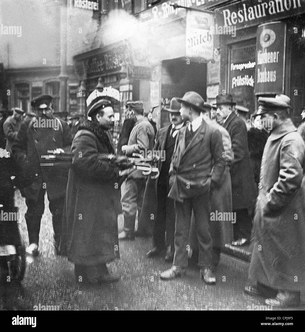 Discharged soldier selling umbrellas in Berlin, 1919 Stock Photo - Alamy