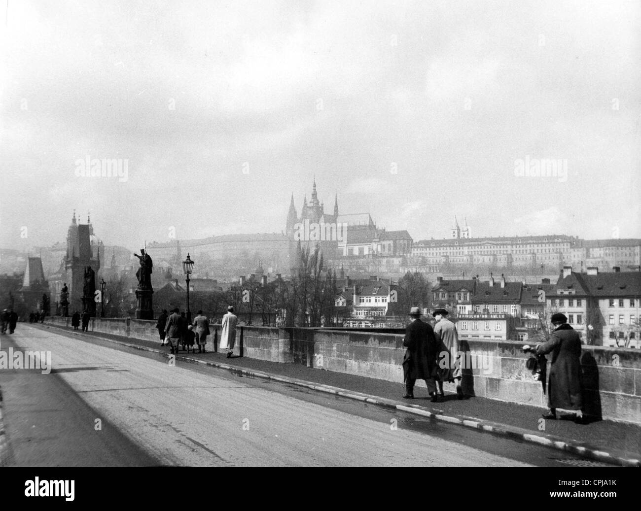 Pedestrian on the Charles Bridge in Prague Stock Photo - Alamy