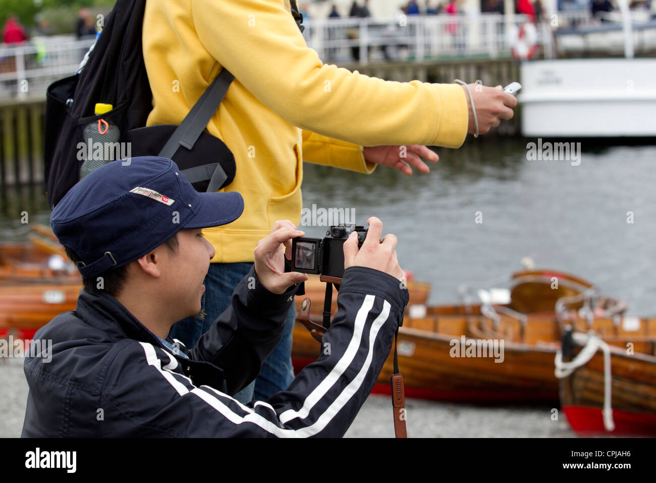 Digital compact camera & photographer taking pictures Stock Photo - Alamy