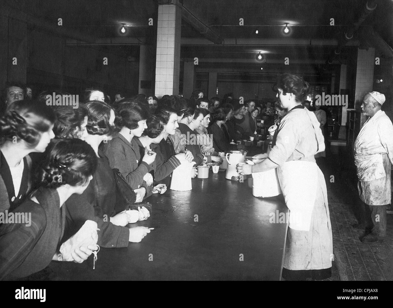 Coffee distribution in a canteen, 1931 Stock Photo - Alamy