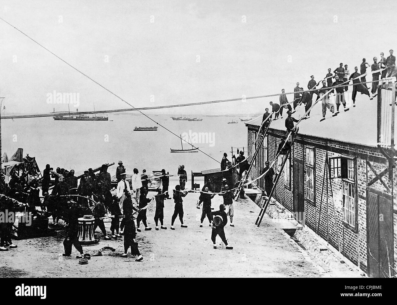Training in fire fighting in the shipyard of Quingdao, 1911 Stock Photo ...