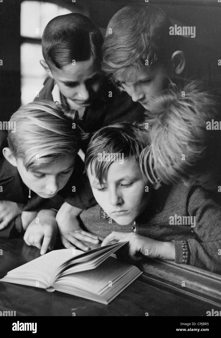 Boys reading, 1942 Stock Photo - Alamy