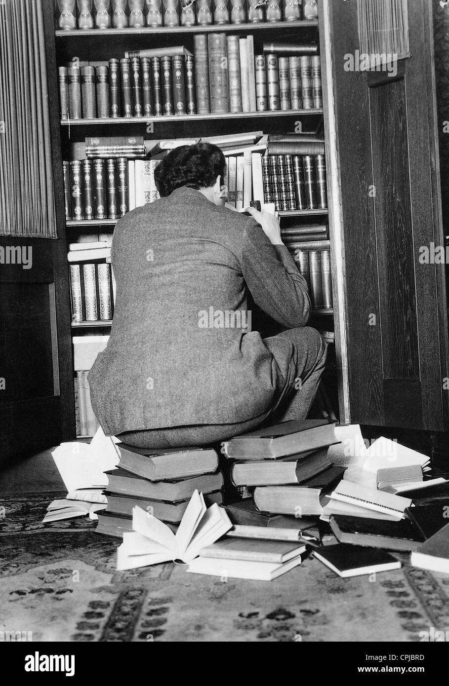 Reading books stack on Black and White Stock Photos & Images - Alamy