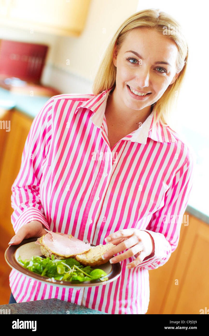 Woman eating healthy meal Stock Photo - Alamy